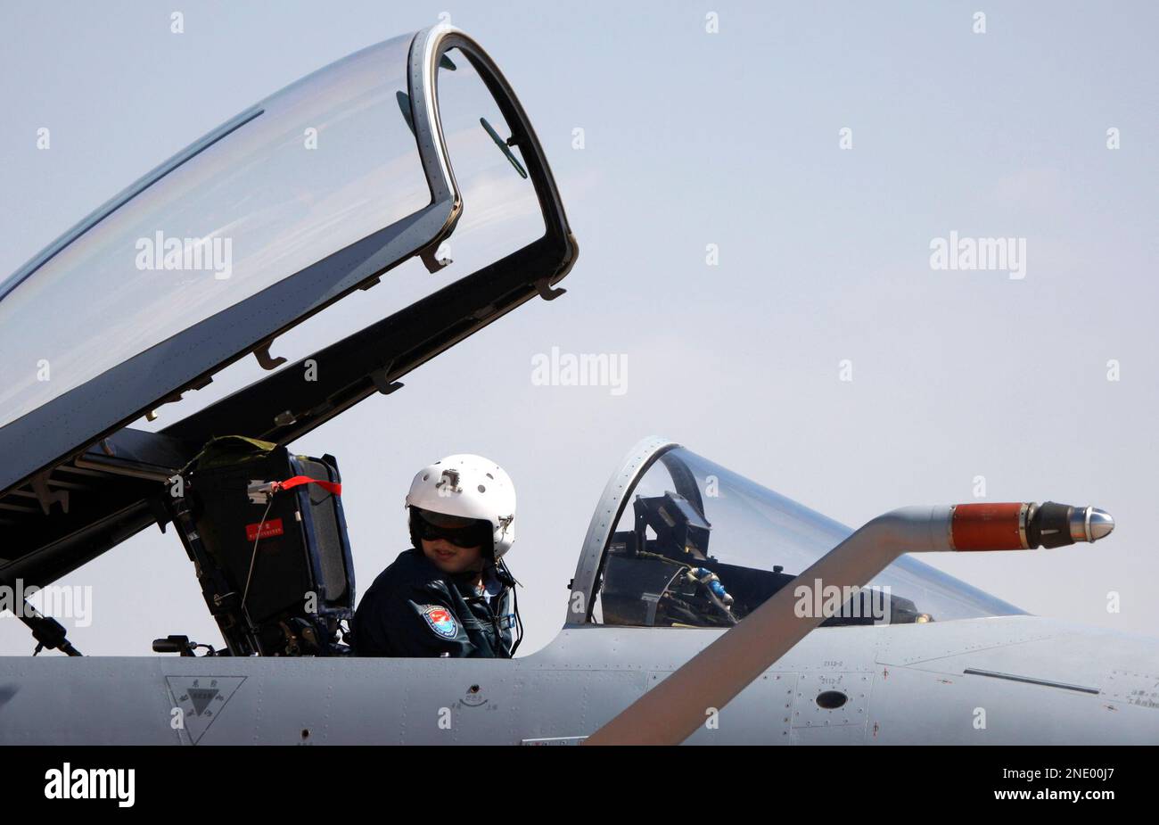 A Chinese People's Liberation Army Airforce pilot sits in the cockpit ...