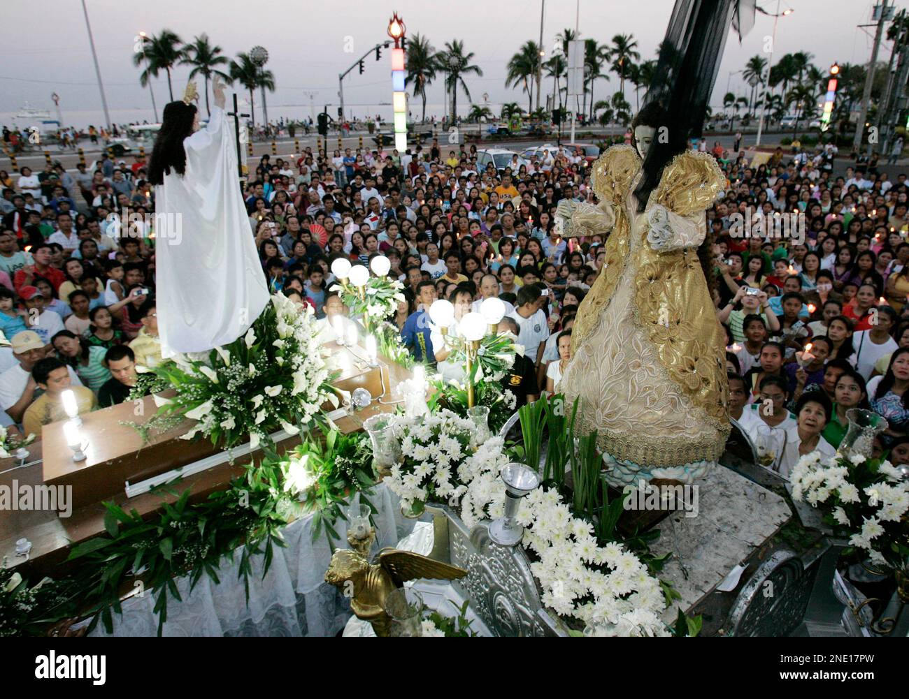 Filipino devotees look as the veil of an image of the Virgin Mary ...