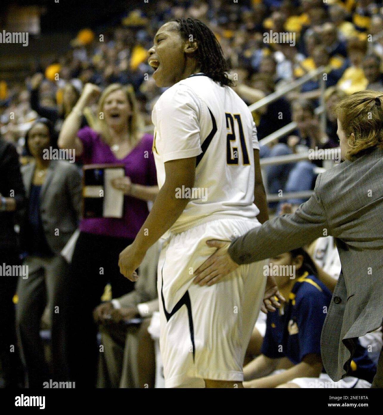 California's Alexis Gray-Lawson, getting a pat from her trainer Ann ...