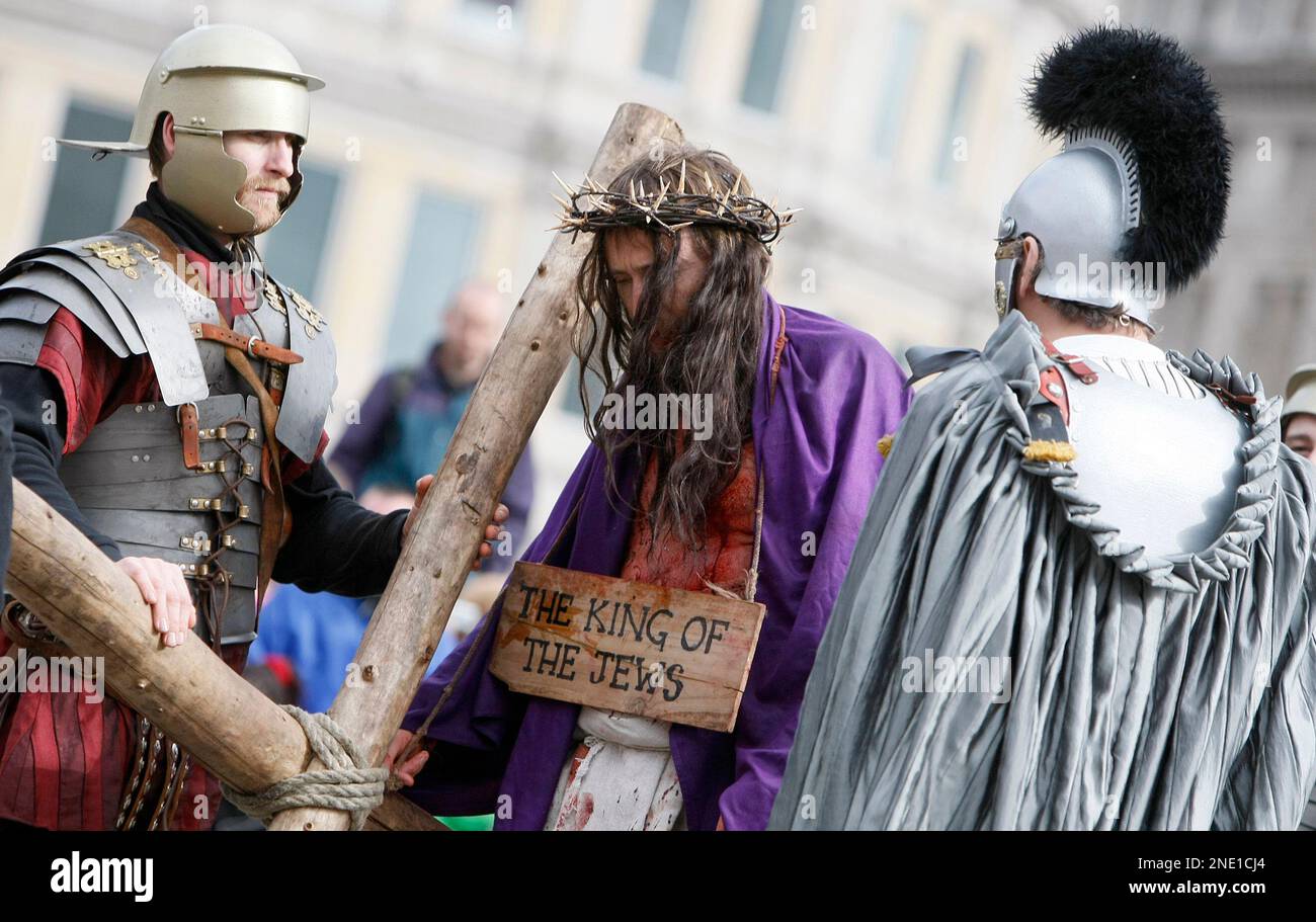 Actors portraying Jesus Christ and Roman soldiers reenact the ...