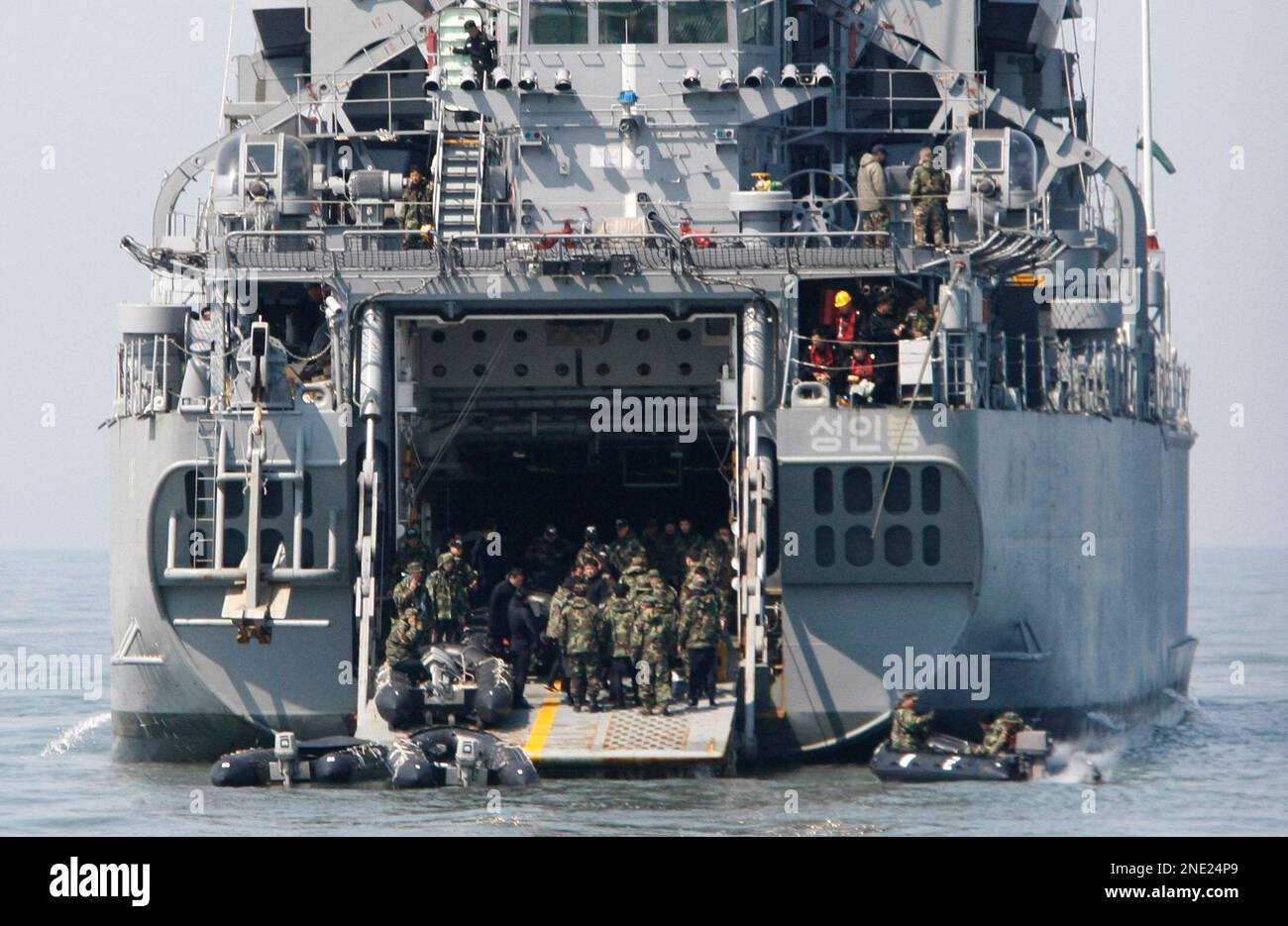 South Korean Navy's Ship Salvage Unit members return from their search for survivors from the ...