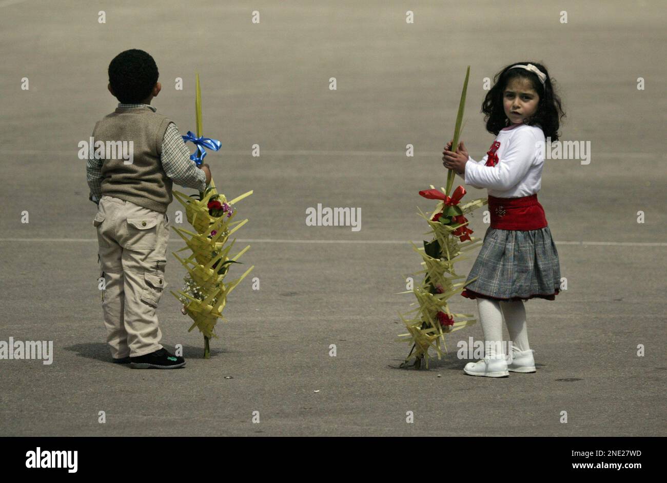Palestinian Orthodox Christian children hold palm fronds on Orthodox ...