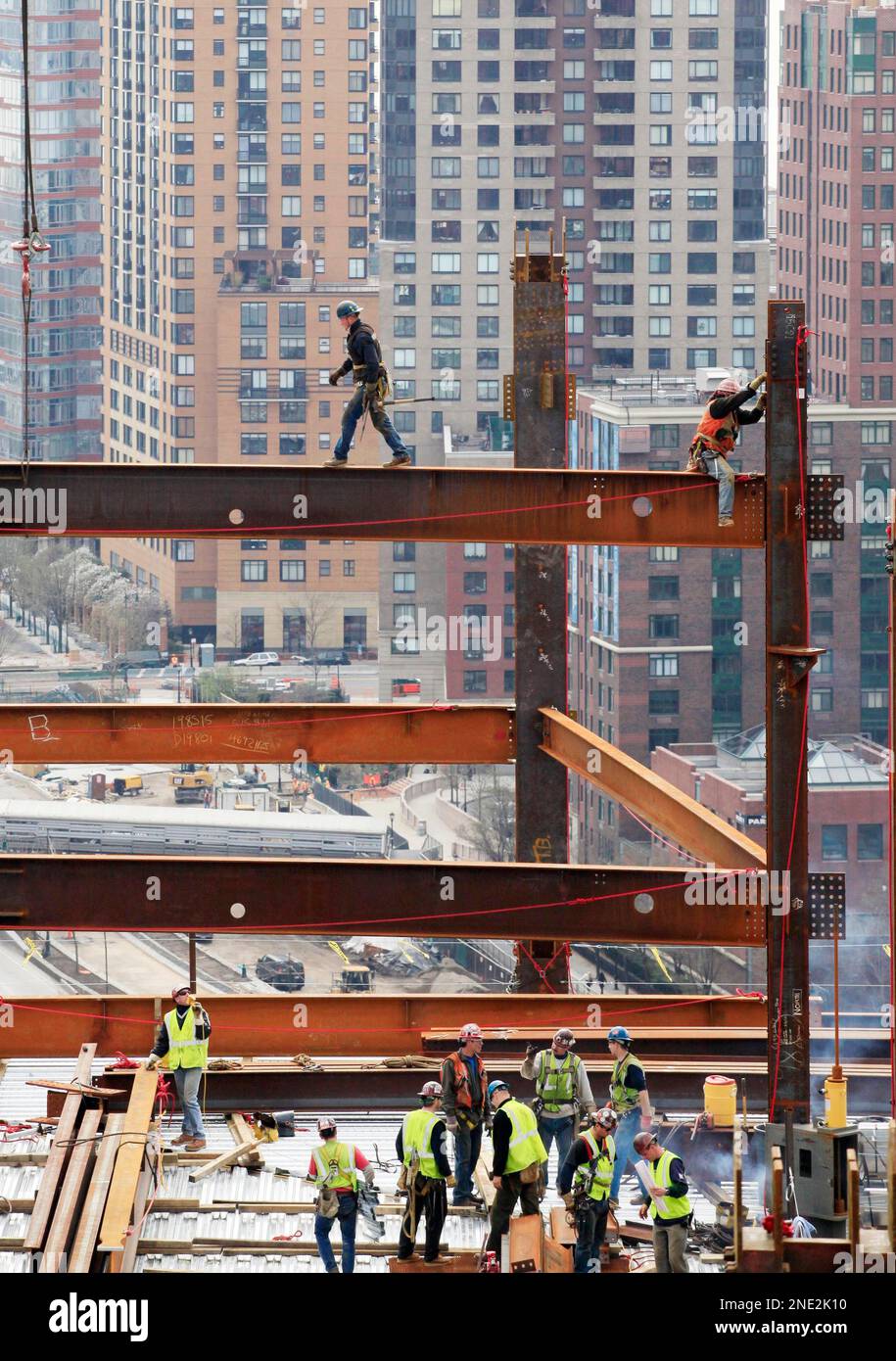 An ironworker walks on a beam at One World Trade Center construction ...