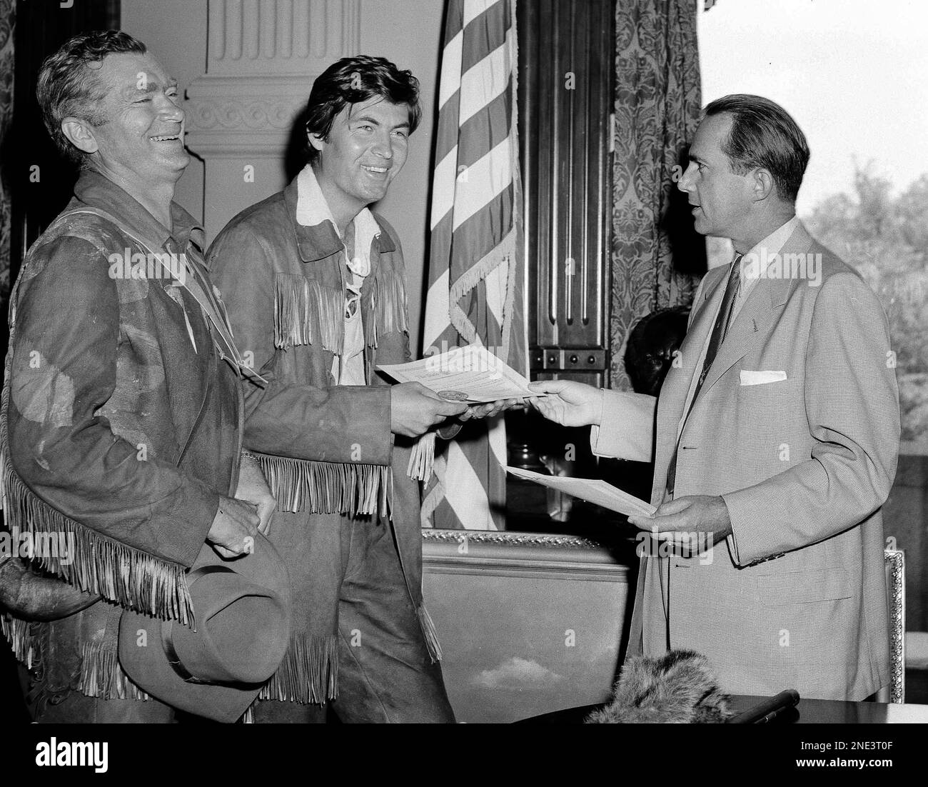 Gov. Allan Shivers, right, presents Fess Parker, movie actor who made ...