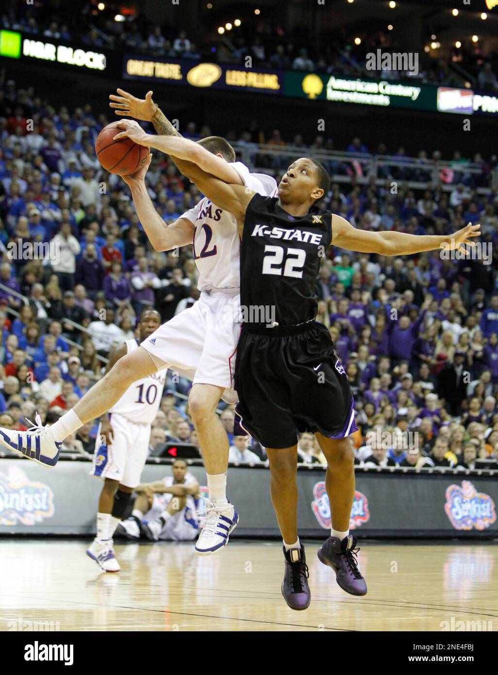 Kansas guard Brady Morningstar, left, catches a pass over Kansas State ...
