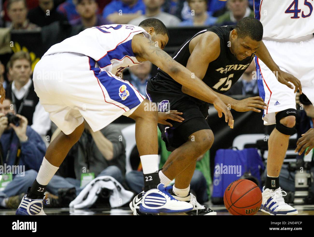 Kansas forward Marcus Morris, left, fights for a loose ball with Kansas ...