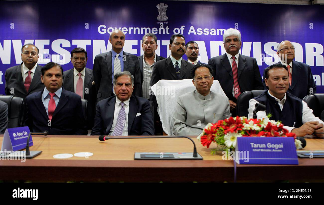 Tata Group Chairman Ratan Tata, seated second left, and Assam state ...