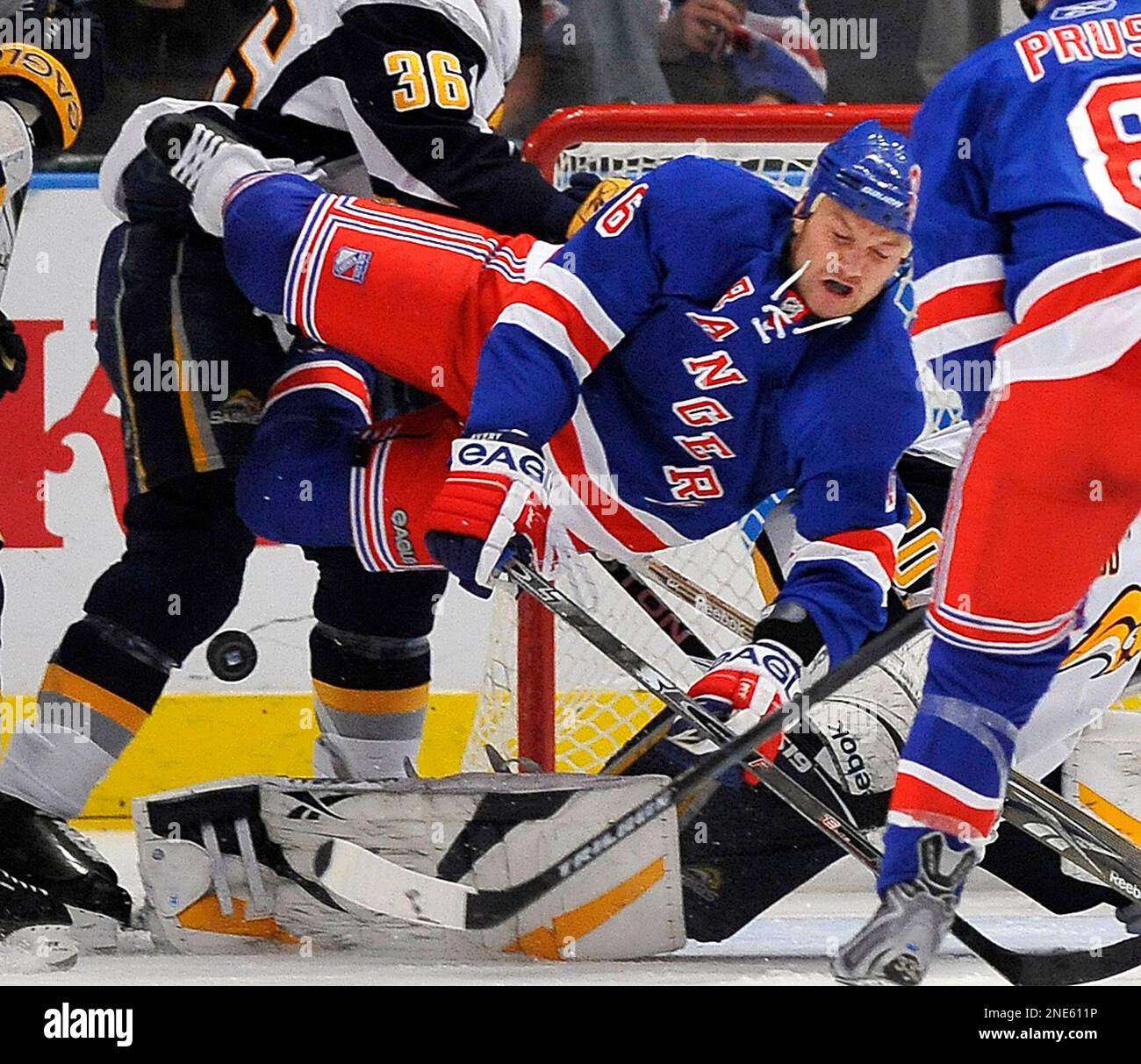 New York Rangers' Sean Avery (16) collides with Buffalo Sabres goalie ...