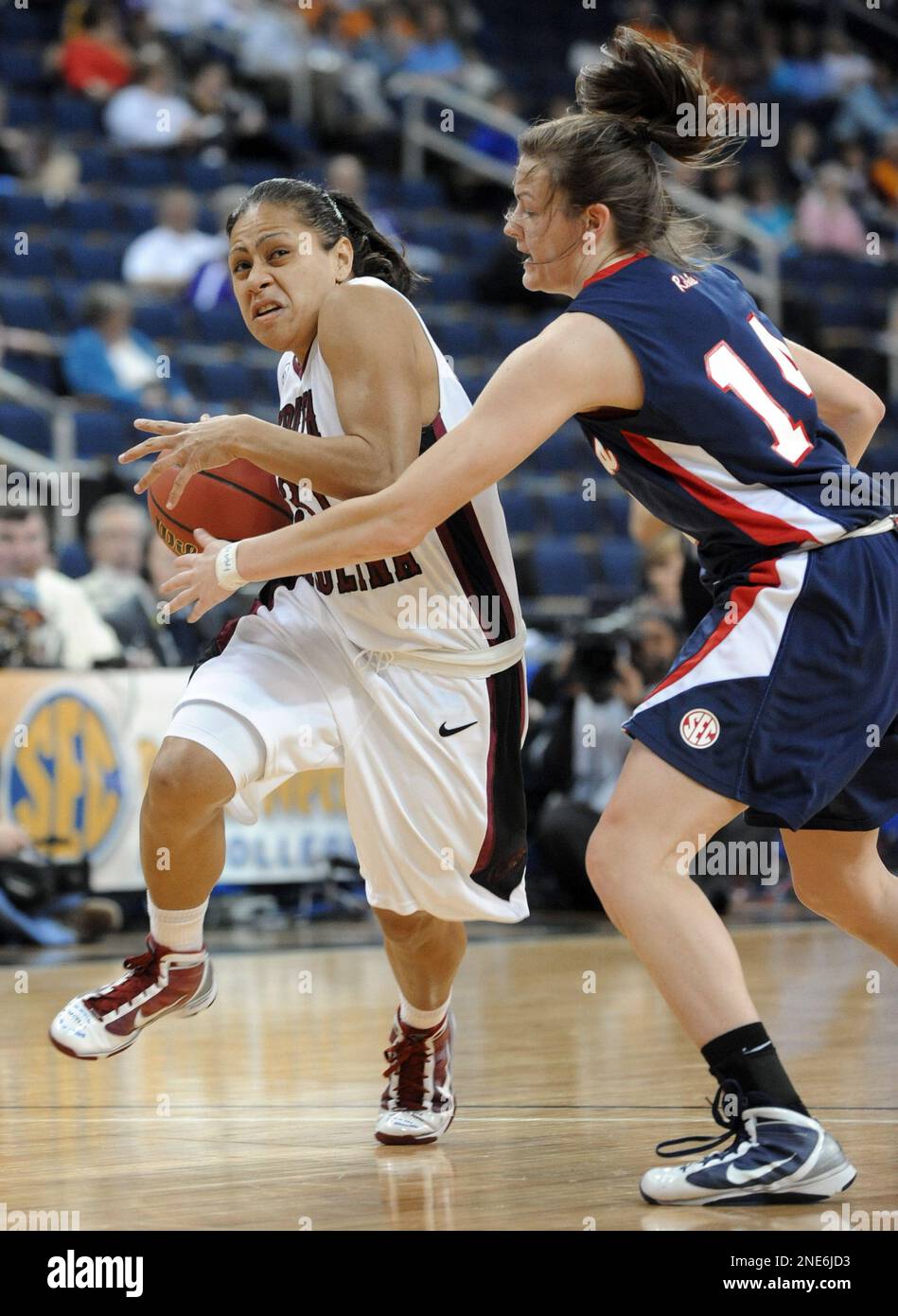 South Carolina guard Valerie Nainima, left, drives into Mississippi guard Elizabeth Robertson ...