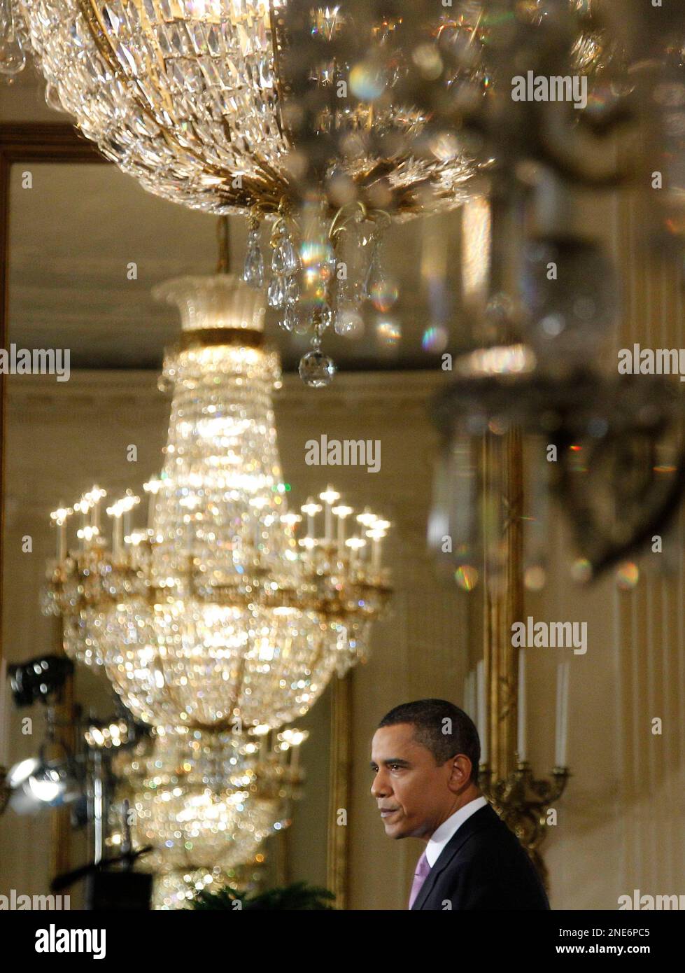 President Barack Obama pauses while speaking about health care as seen ...