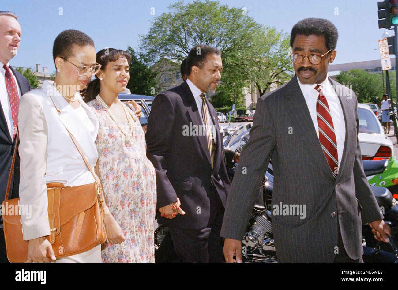Former NAACP Executive Director Benjamin Chavis, followed by his wife ...