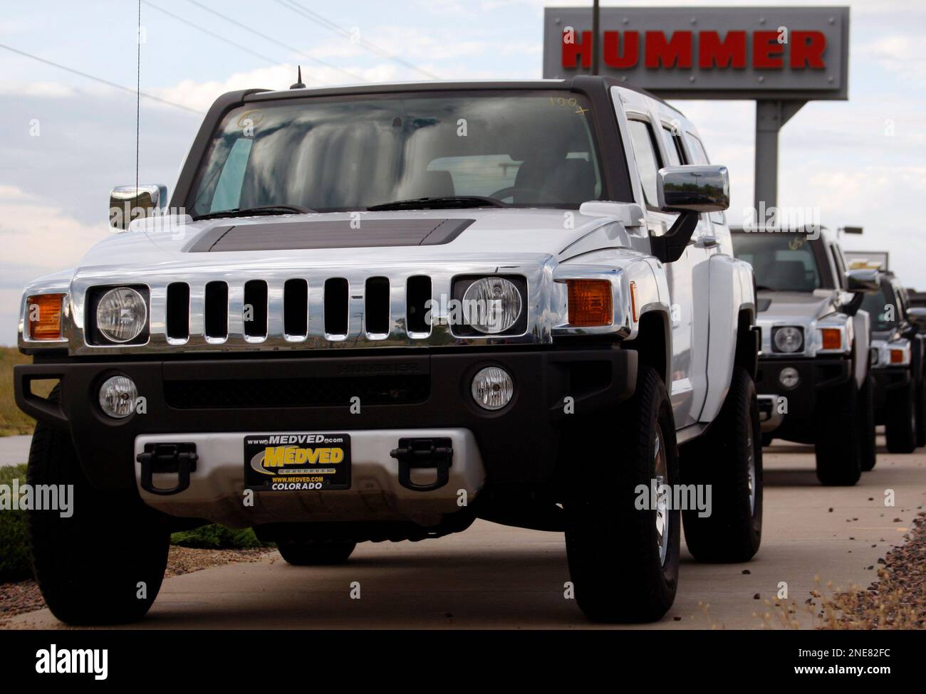 FILE - In this July 6, 2008 file photo, a long row of unsold H3's sit ...