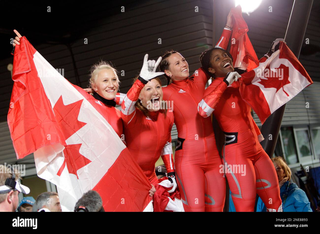 Gold medalists Canada's CAN-1, pilot Kaillie Humphries, left and ...