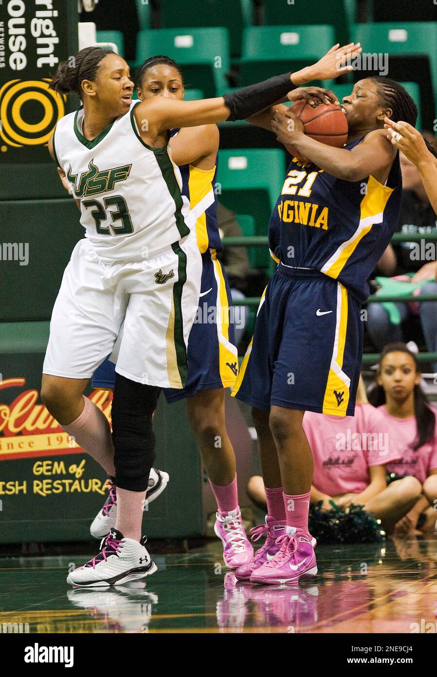 West Virginia's Korinne Campbell (21) grabs a rebound from South ...