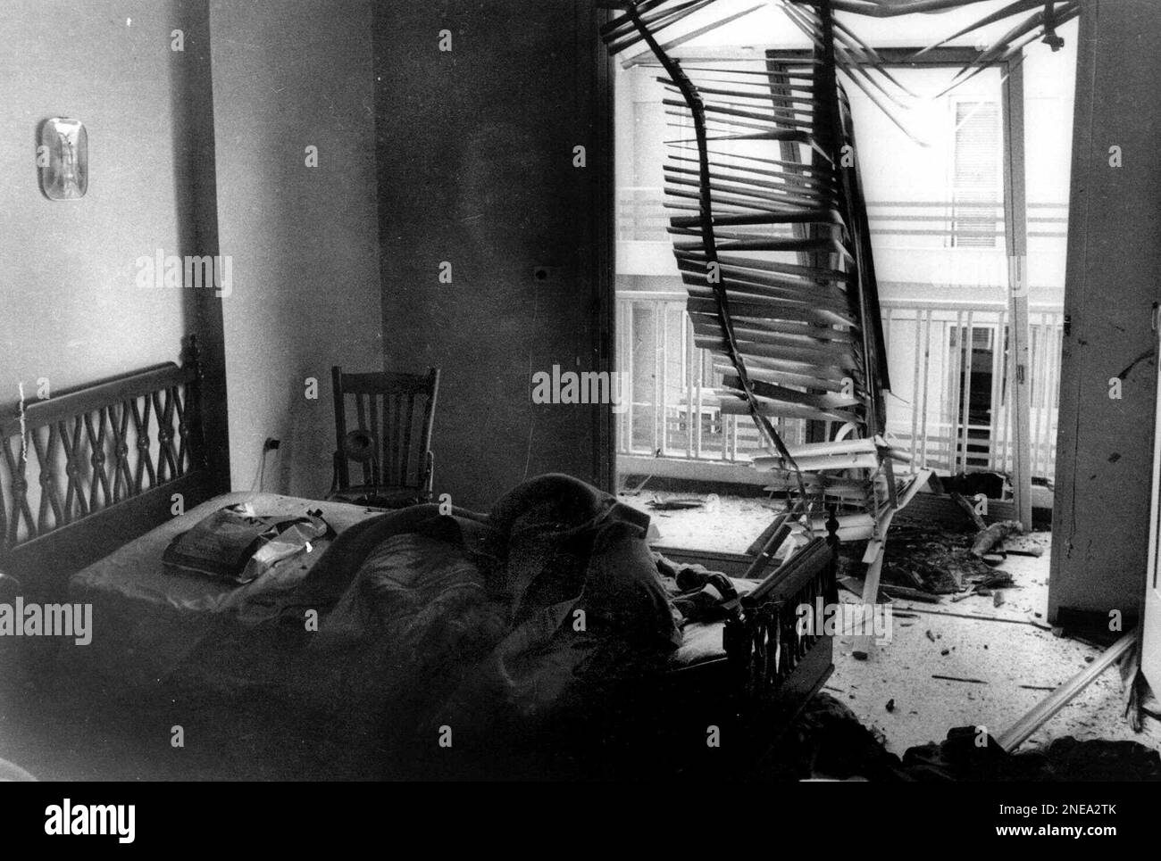 FILE - In this April 10, 1973 file photo bullet holes and signs of the ...