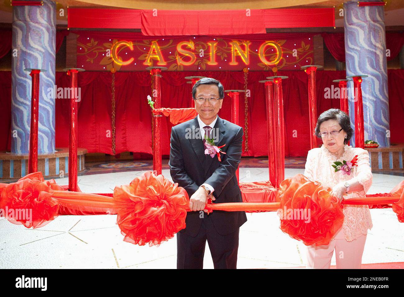 Chairman of Resorts World Sentosa and the Genting Group, Tan Sri Lim Kok Thay, and his mother ...