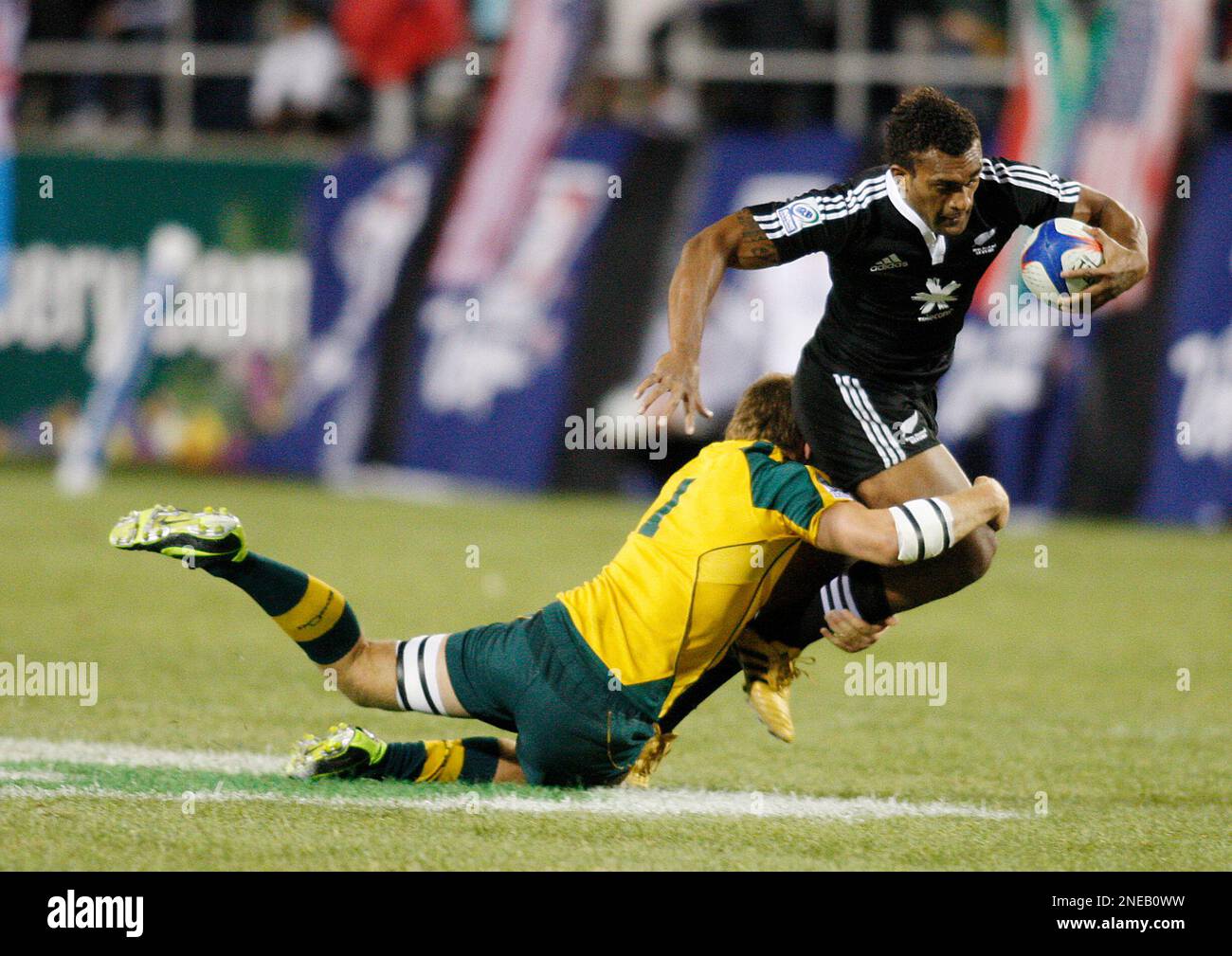 Australia's Pat McCutcheon tackles New Zealand's Save Tokula during ...