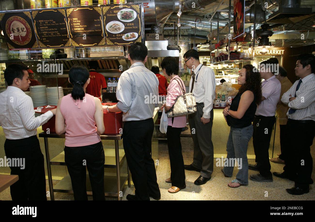 In this photo taken on Jan. 14, 2010, customers line up to order their ...