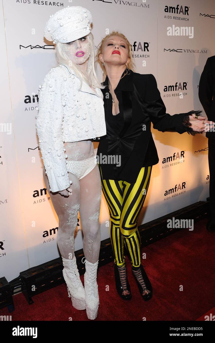 Singer Lady Gaga Left And Singer Cyndi Lauper Attend The Amfar American Foundation For Aids