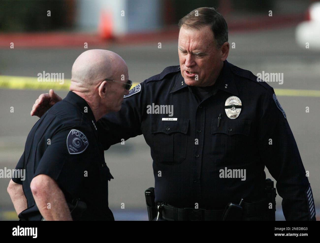 Gilbert, Ariz. Police Chief Tom Dorn, left, is comforted by Gilbert ...