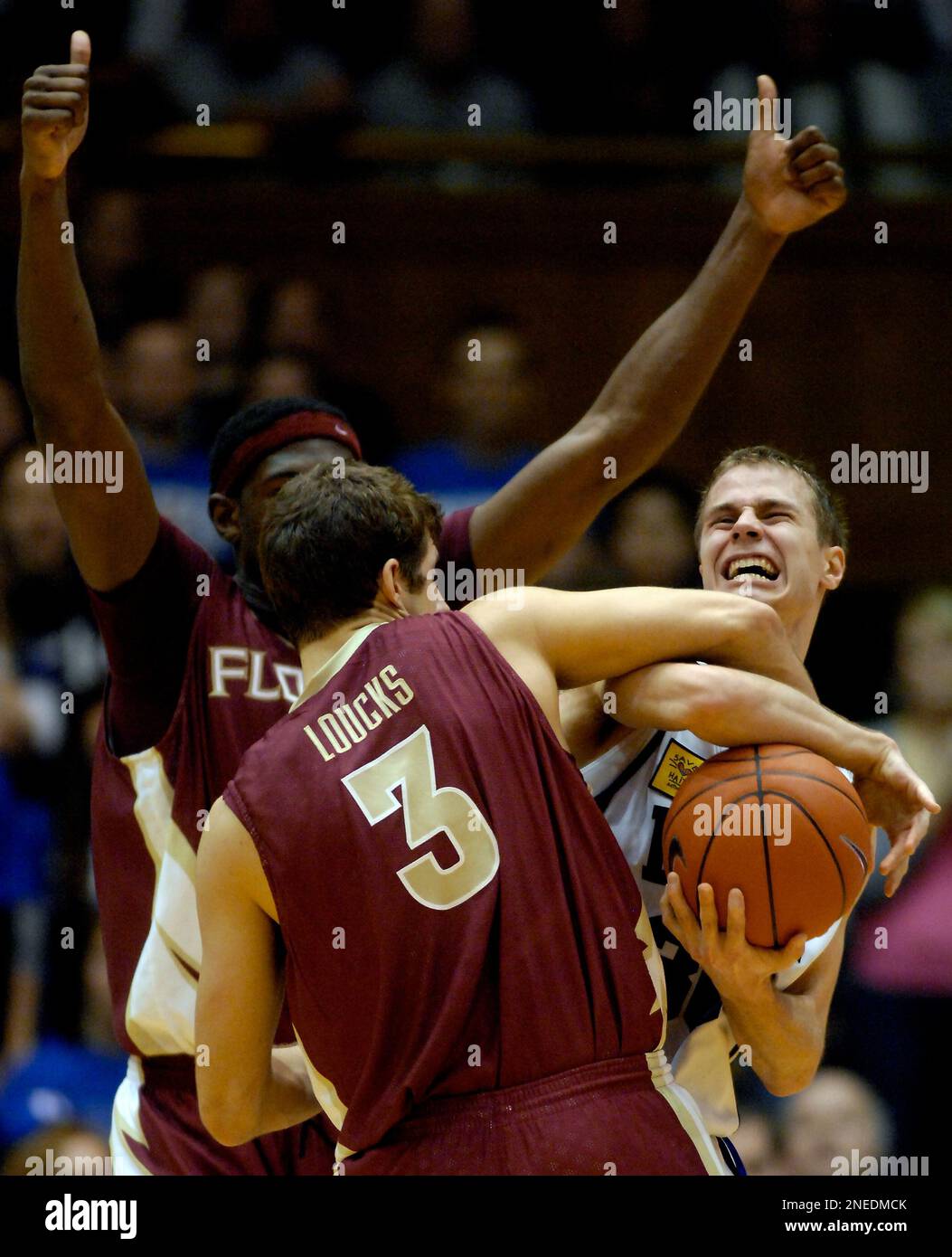 Duke's Jon Scheyer, right, struggles to keep the ball from Florida ...