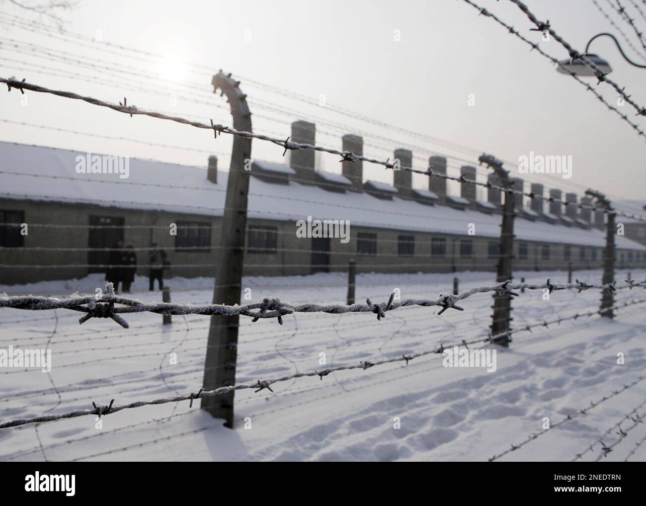 Visitors walking in snow and cold at the former Nazi death camp of ...