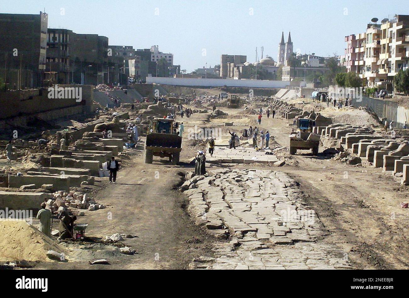 Egyptian workers in Luxor, Egypt, restore the Alley of Sphinxes, Sunday ...