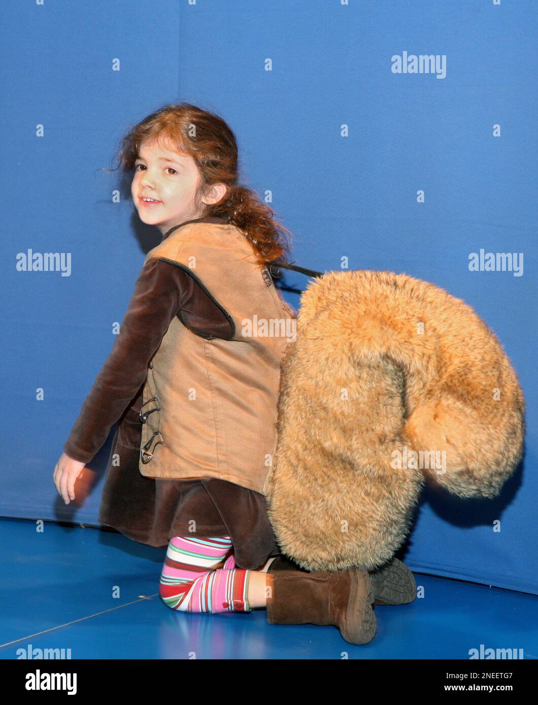 Gracie A. wears a squirrel costume at Doubletree Hotels and Arbor Day ...
