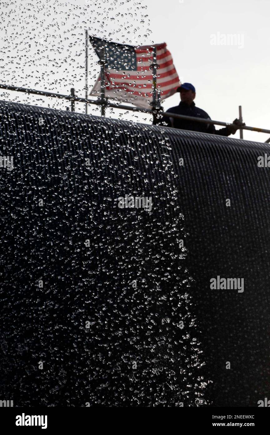 Ribbons of water flow off a mock-up waterfall designed for the National ...