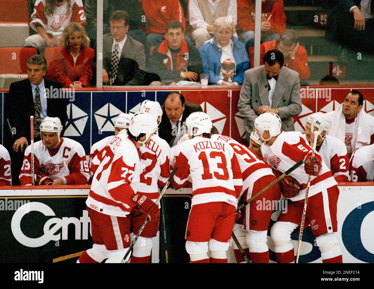 Detroit Red Wings players huddle around head coach Scotty Bowman ...