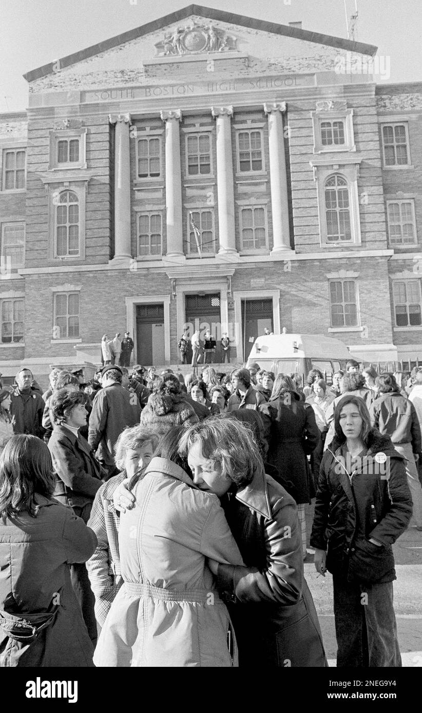 A South Boston High School student cries on the shoulder of a friend on Wednesday, Dec. 11, 1974 ...