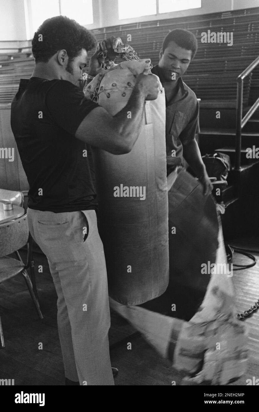 Muhammad Ali (right) and his attendant unpack a punching bag as the ...