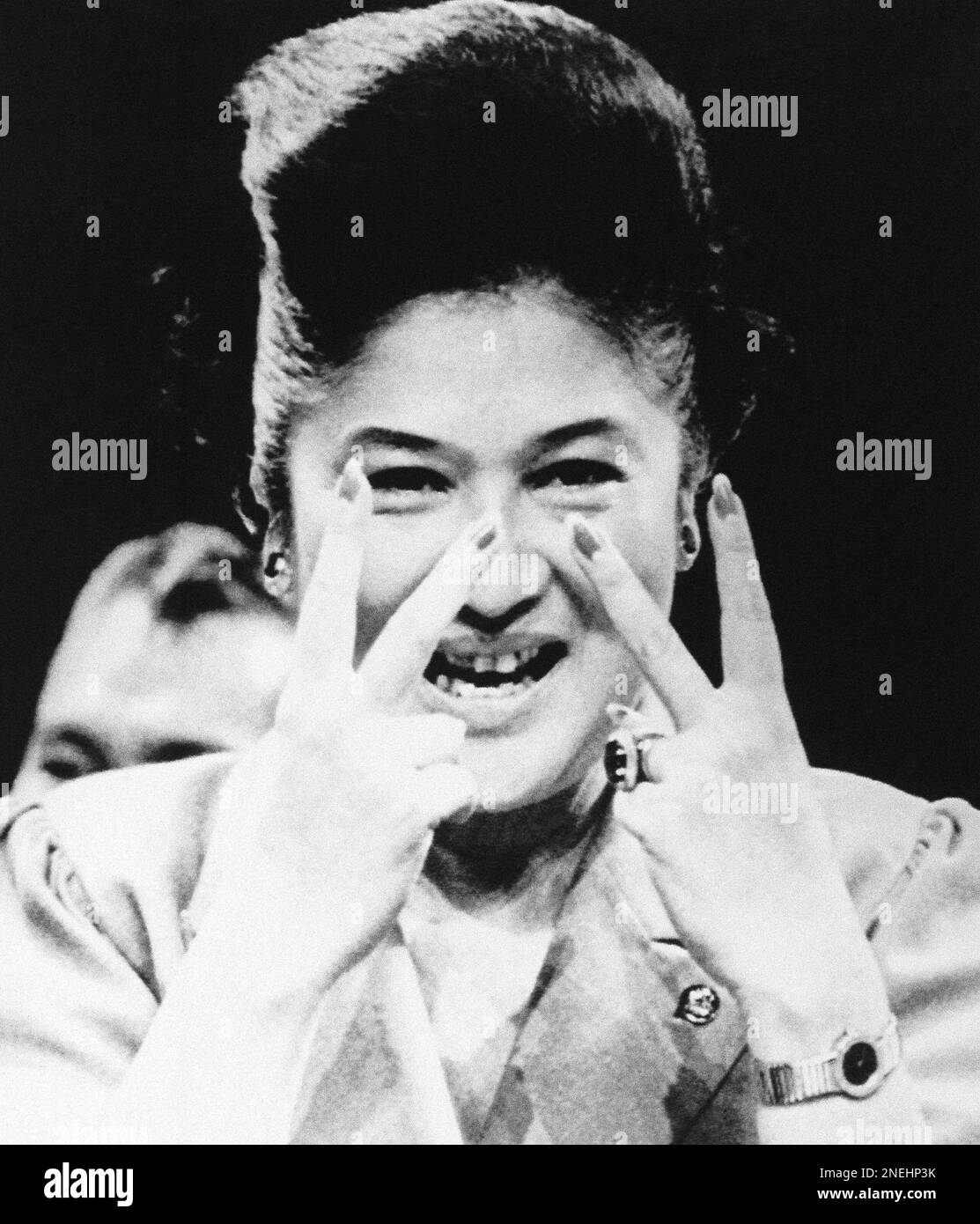 Philippine First Lady Imelda Marcos acknowledges the cheers of an ...