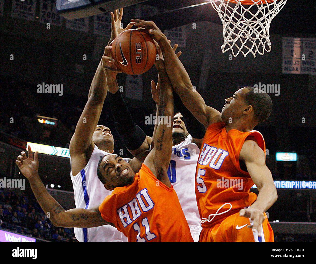 Houston Baptist guards Jamal Robertson (11) and Miles Dixon fight for a ...