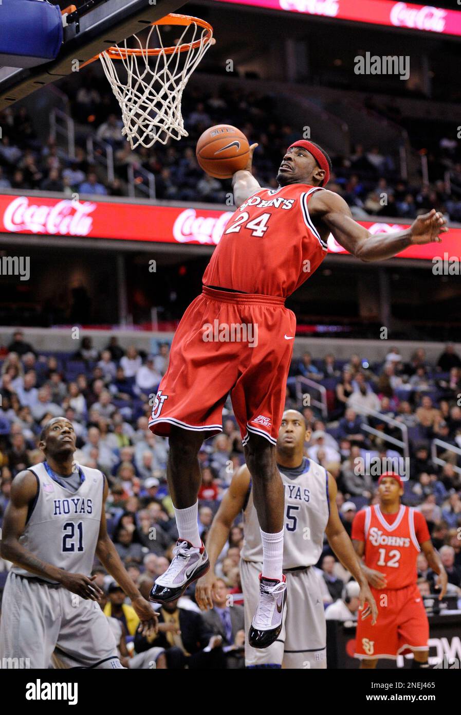 St. John's Justin Burrell (24) goes to the basket against Georgetown's ...