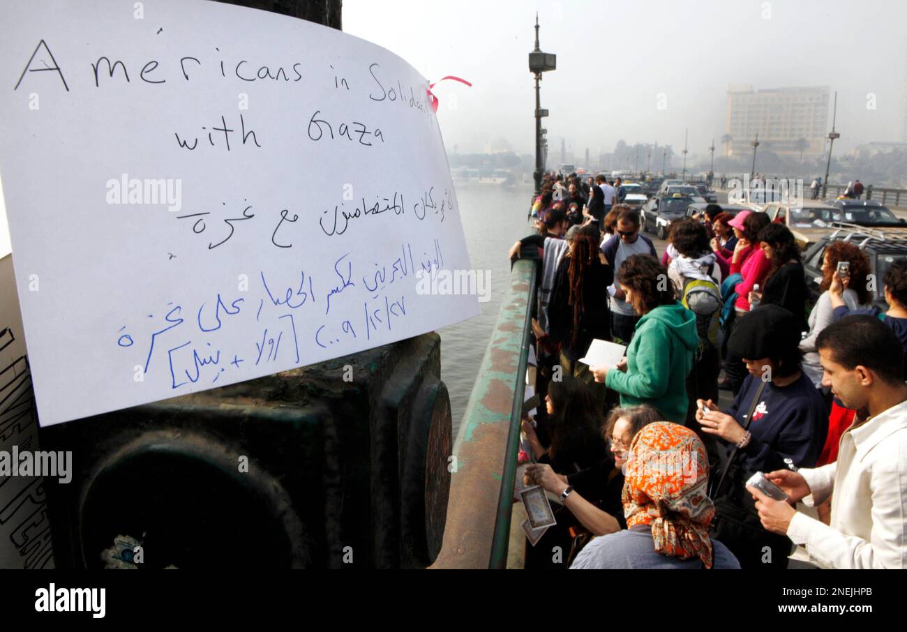 Activists of "Gaza Freedom Marchers" hang messages to Palestinian ...