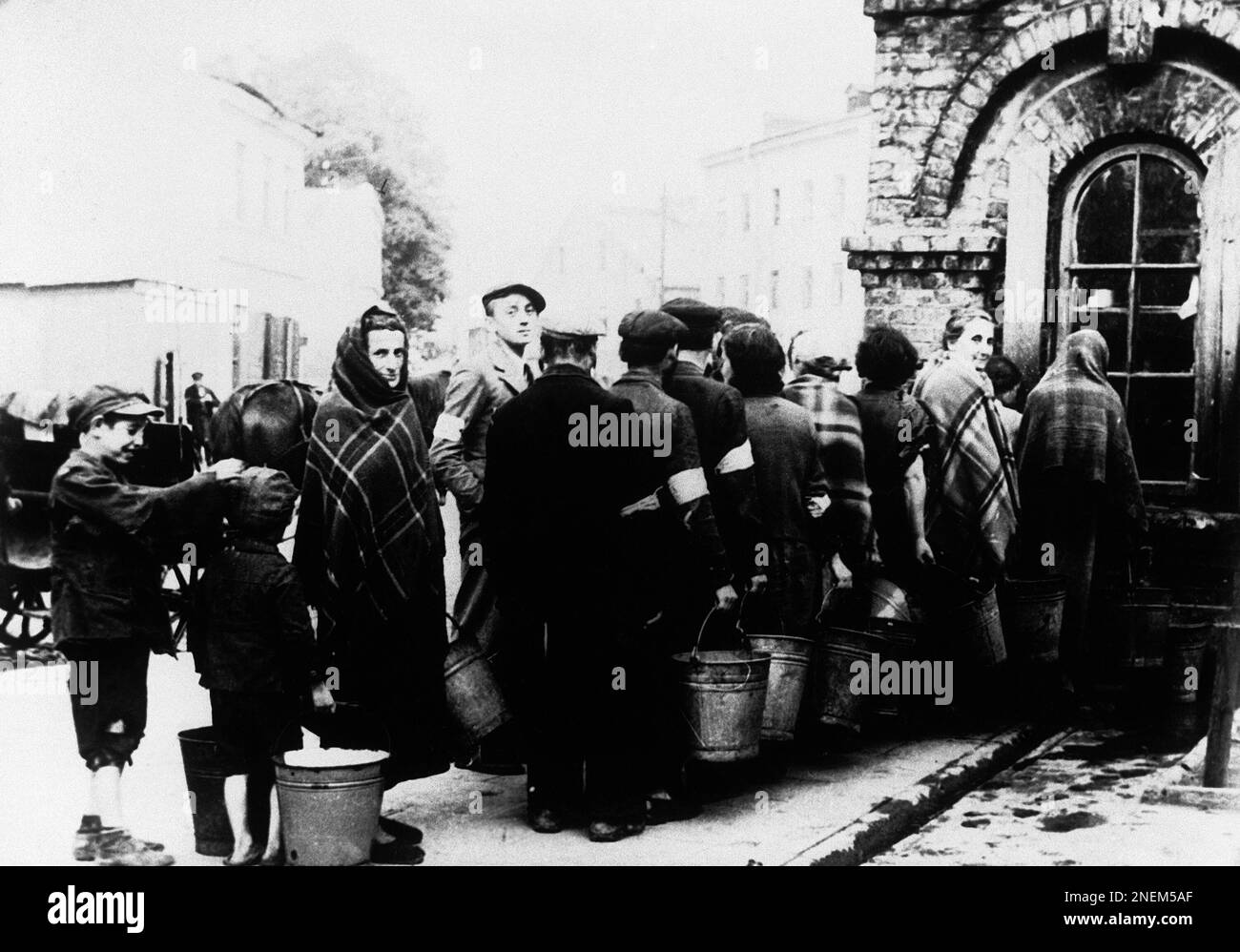 Stricken polish Jews lining up to draw water in the newly-established ...