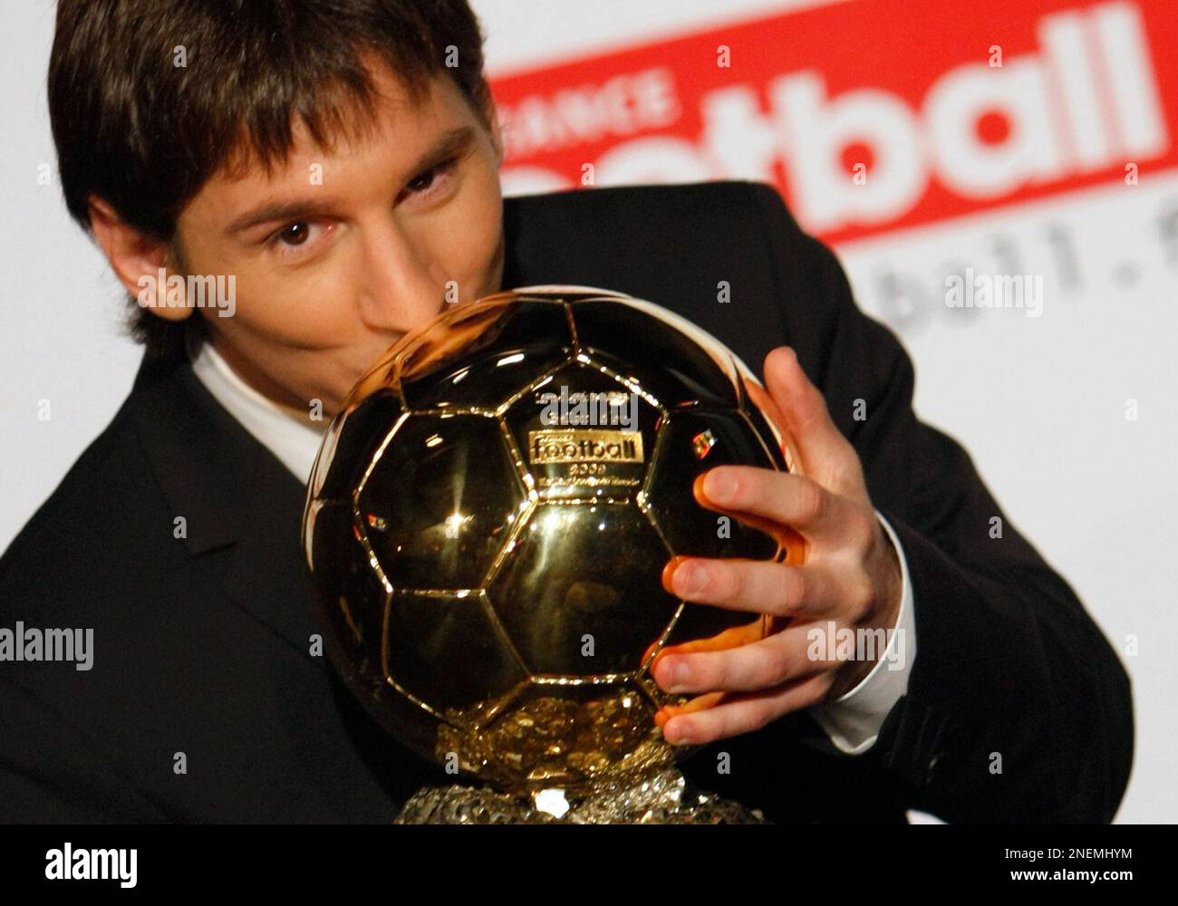 FC Barcelona's Lionel Messi, from Argentina, kisses his 'Ballon d'Or ...