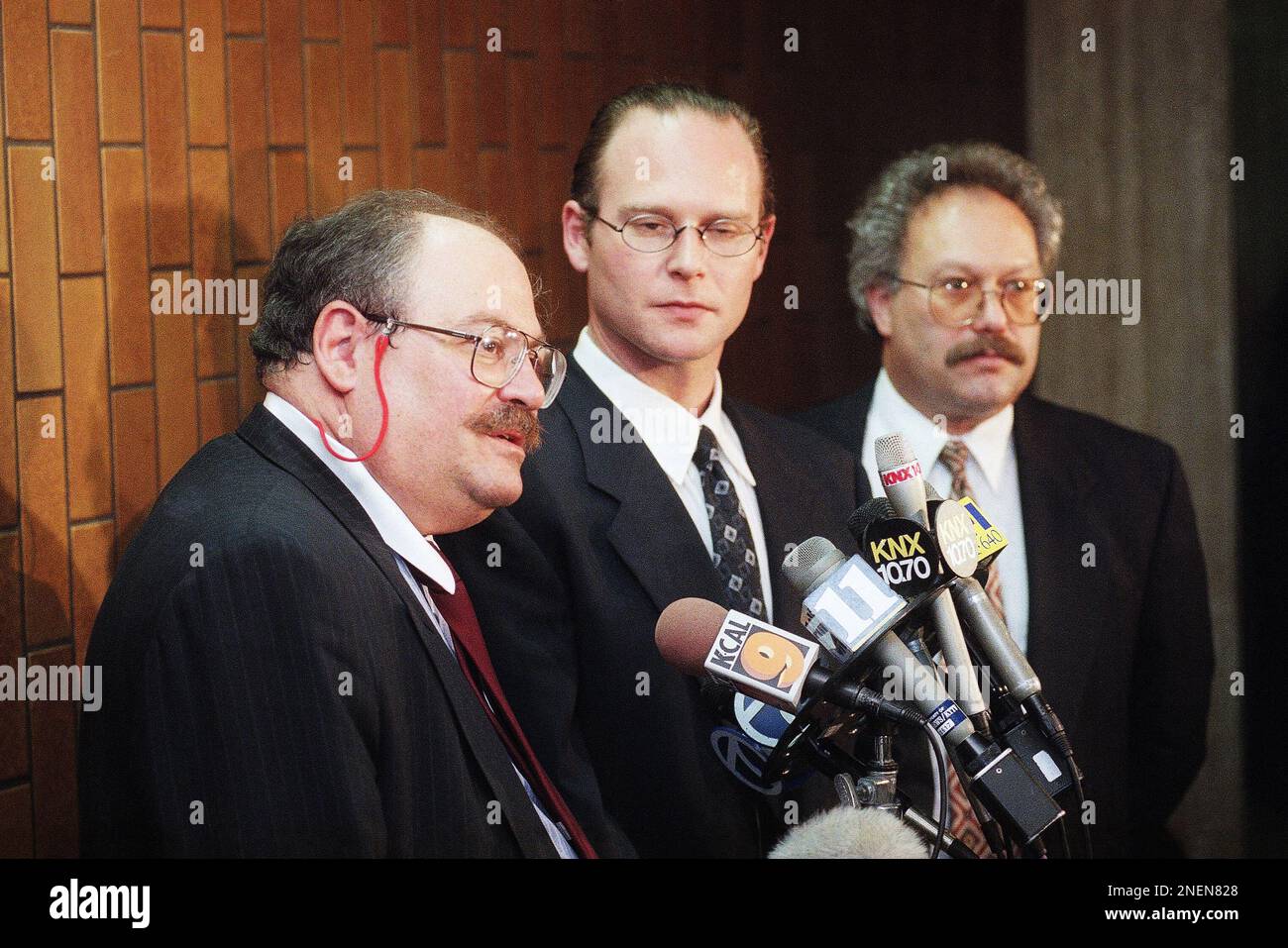 Defense attorney Charles Lindner, left, speaks at an impromptu news ...