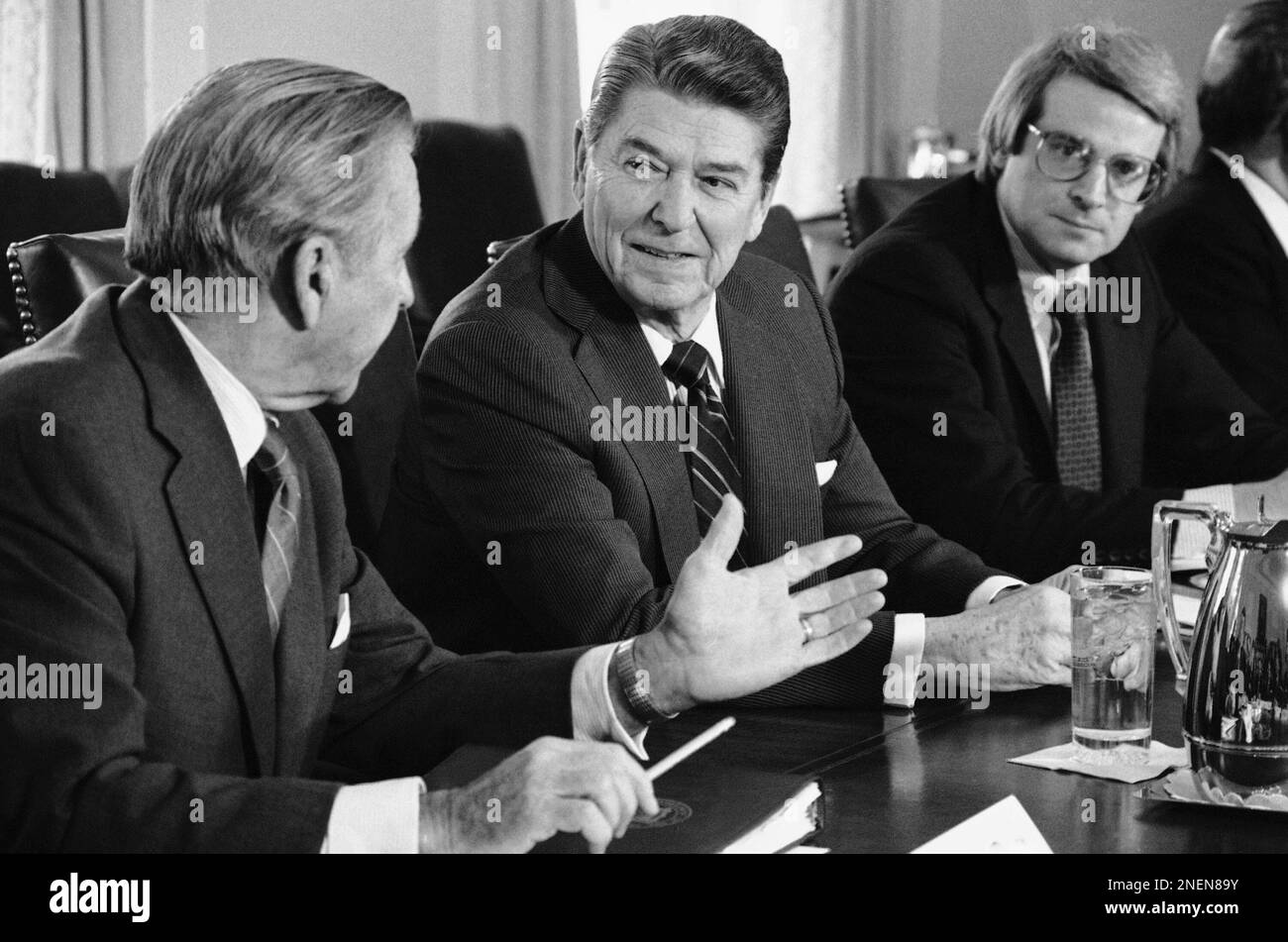 President Ronald Reagan talks with Treasury Secretary Donald Regan ...
