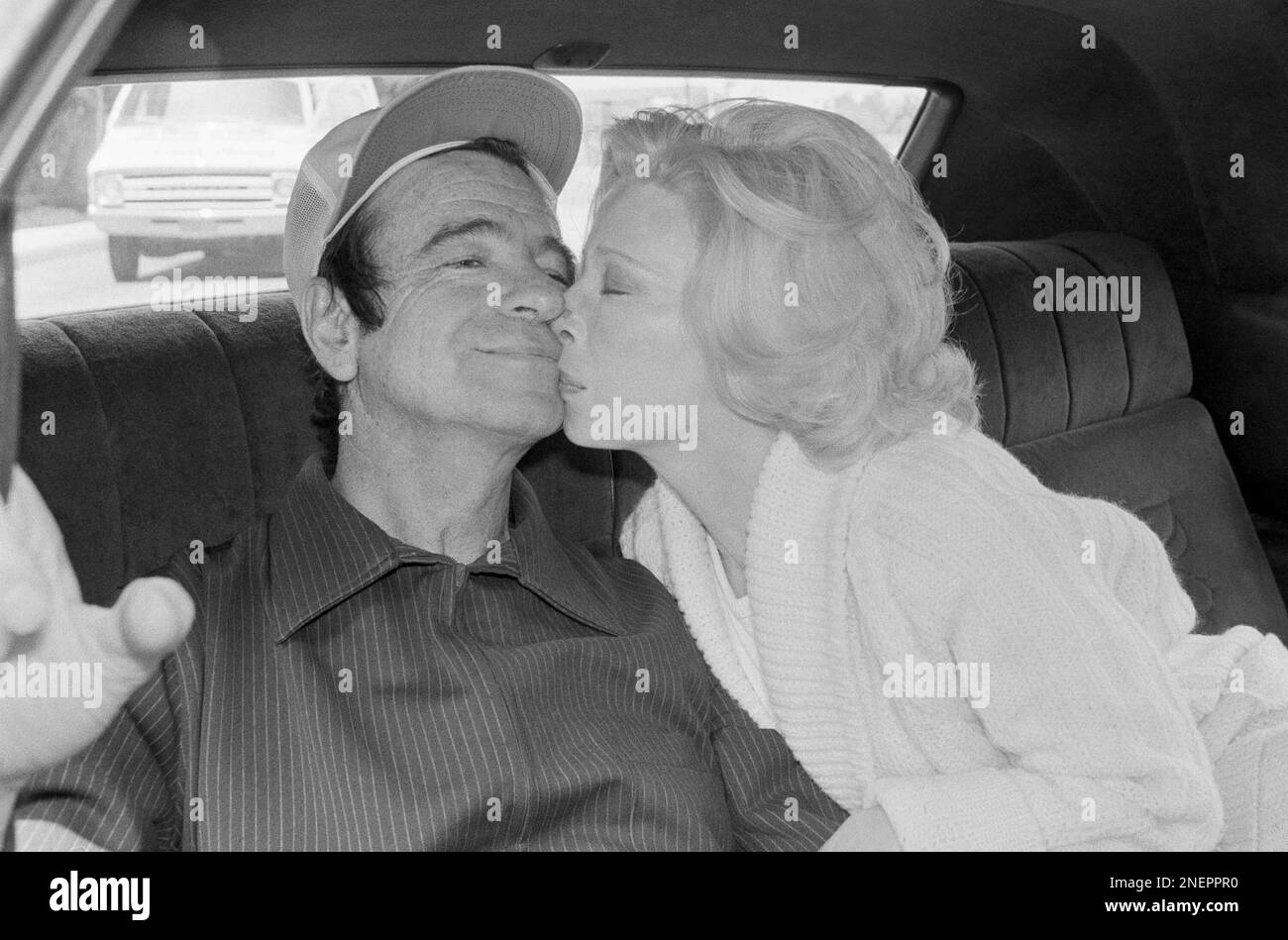 Academy Award winning actor Walter Matthau gets a kiss from his wife ...