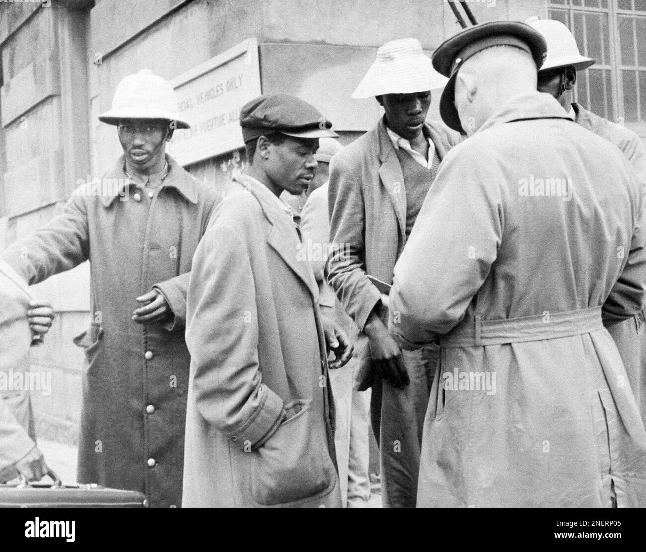 Police check the passbooks of Africans in a street in Central ...