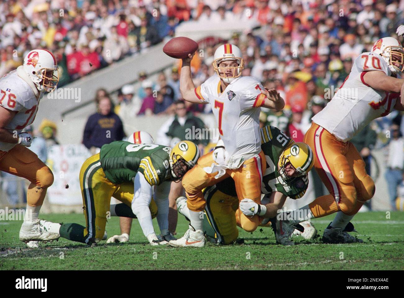 Tampa Bay Buccaneers quarterback Craig Erickson (7) tries to unload a ...