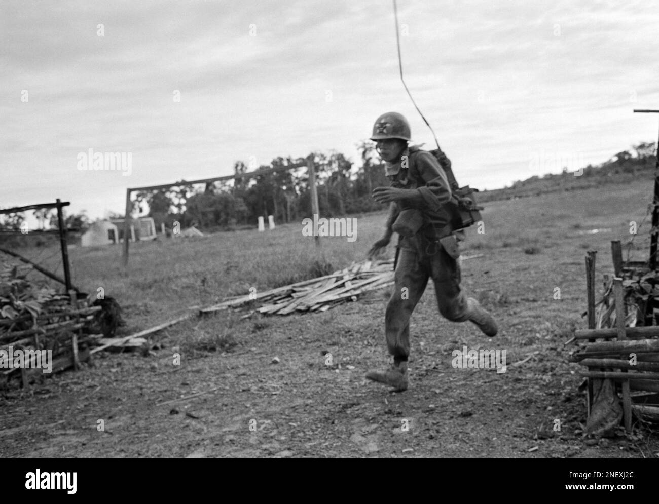 A Vietnamese ranger sprints through Viet Cong sniper fire in Dong Xoai ...