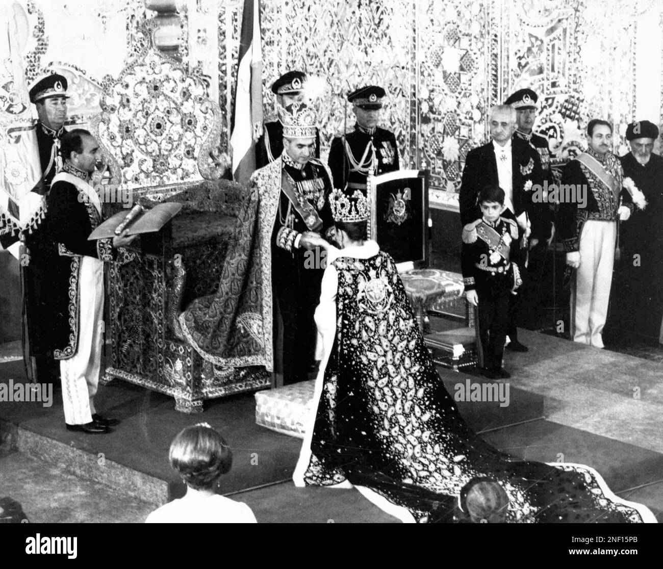 Empress Farah takes the hand of her husband, Shah Mohammad Reza Pahlavi ...