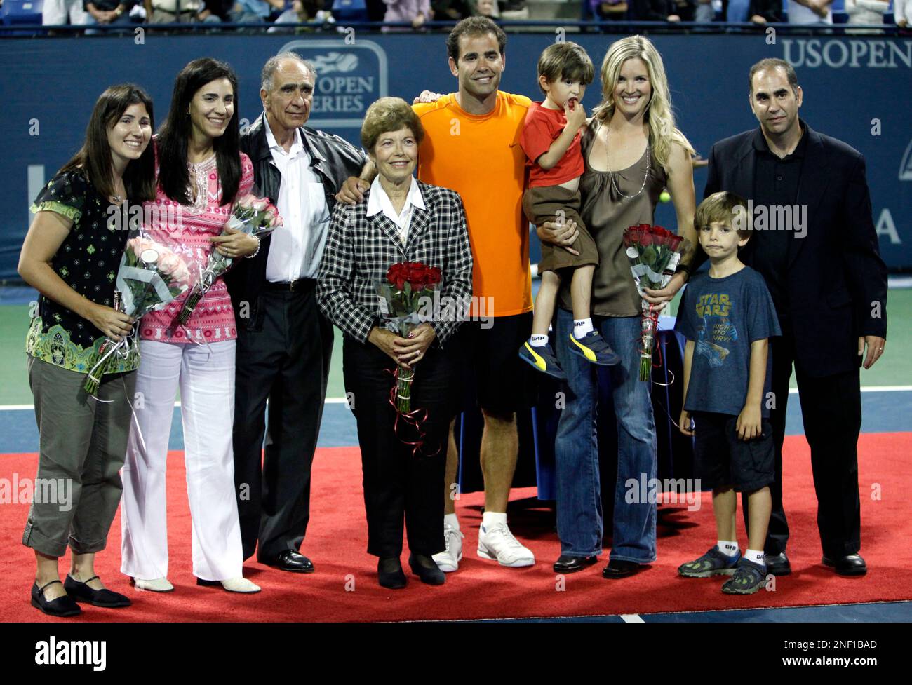 Pete Sampras, of the United States, poses with family members during a ...