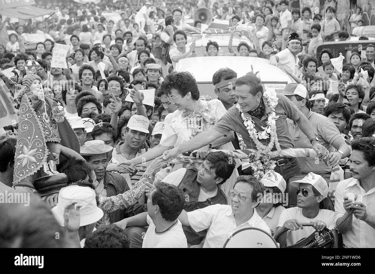 Opposition presidential candidate Corazon Aquino and her running mate ...