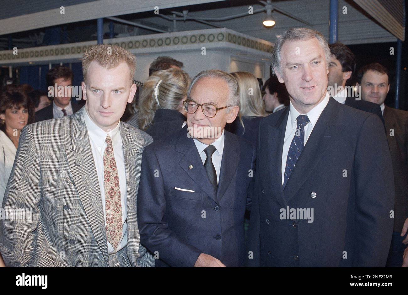 Dino De Laurentiis, center, is joined by actors John Stanton, left, and ...