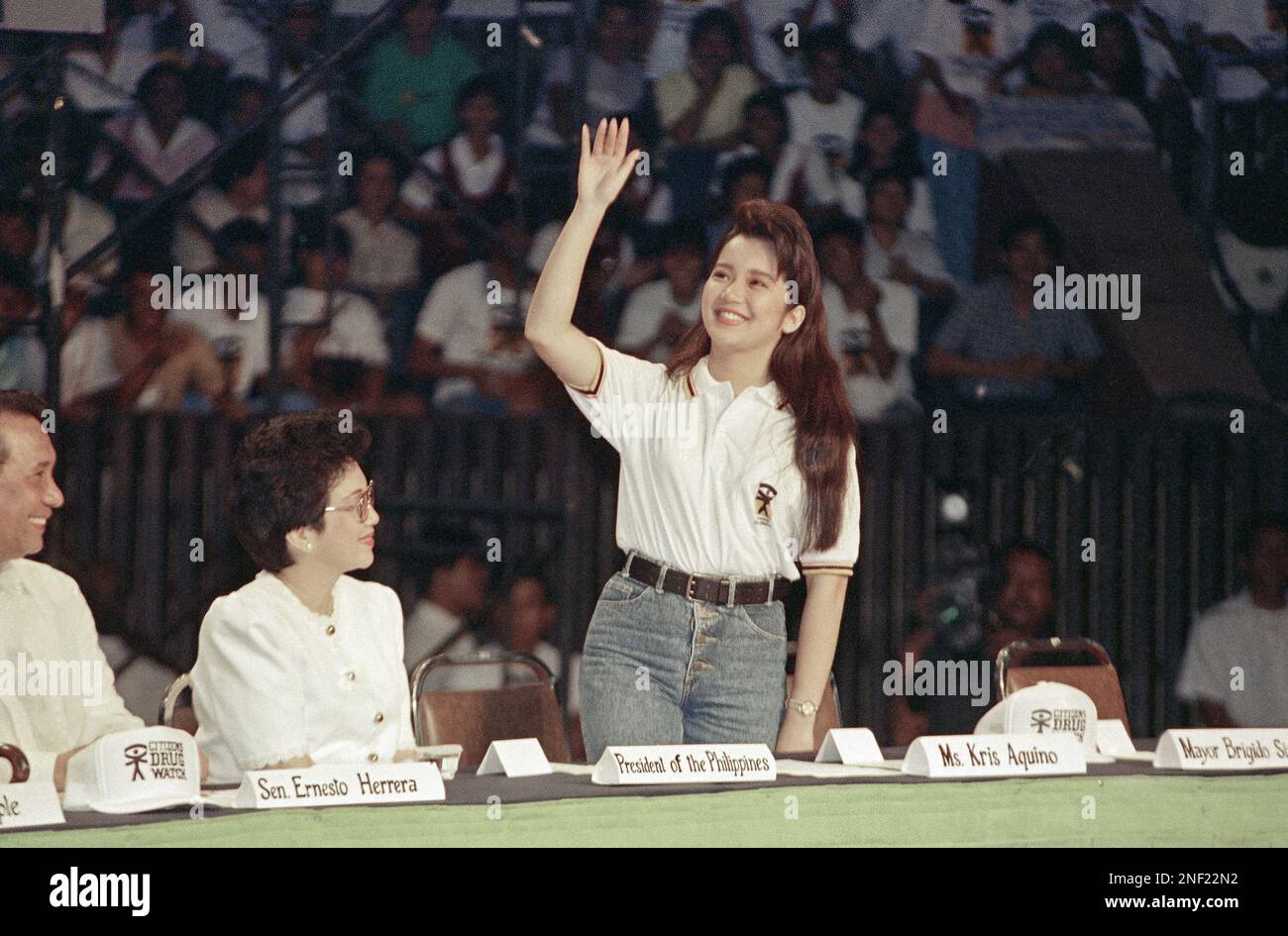 An amused President Corazon Aquino, left, watches as her youngest ...