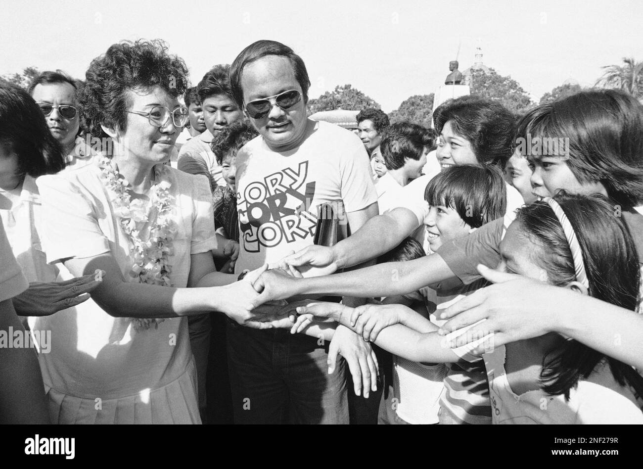Opposition presidential candidate Corazon “Cory” Aquino, left, is ...